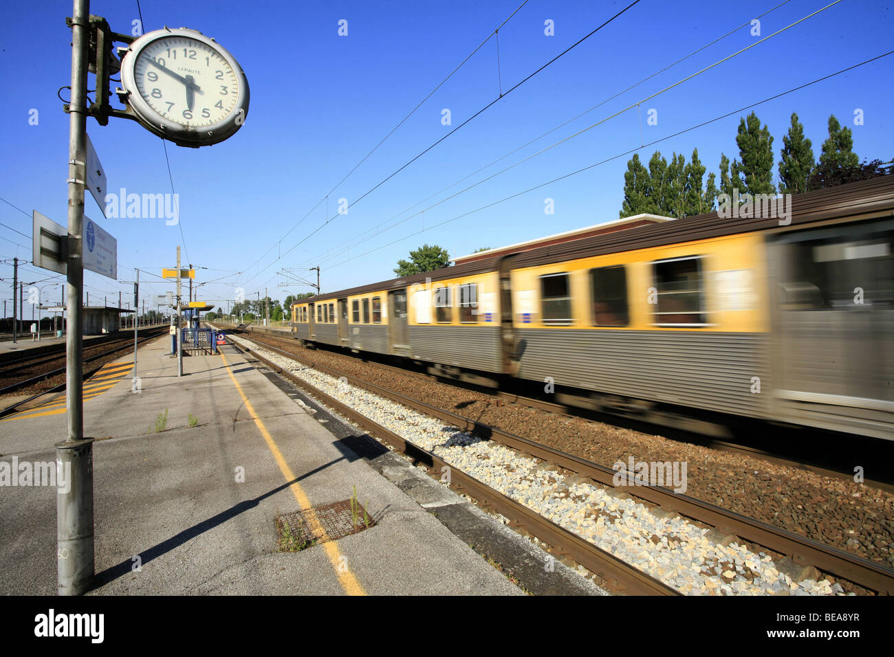 Train and clock Stock Photo - Alamy