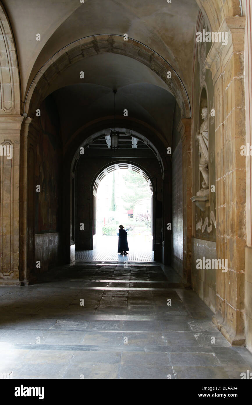 Monk in archway at the Benedictine abbey, Santa Maria de Montserrat ...