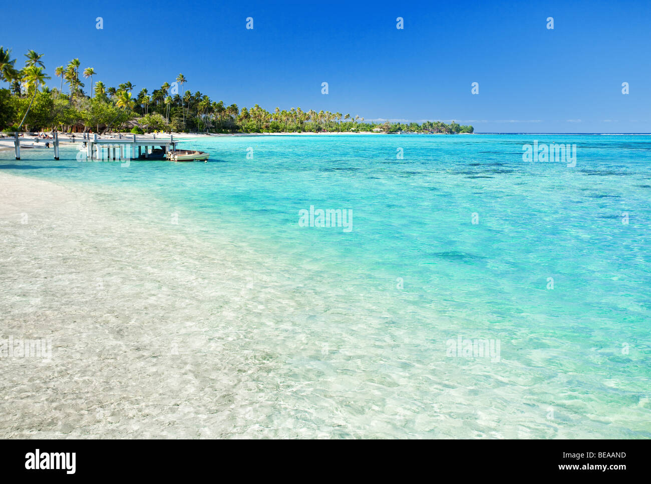 Little jetty and boat on tropical beach with amazing water Stock Photo ...