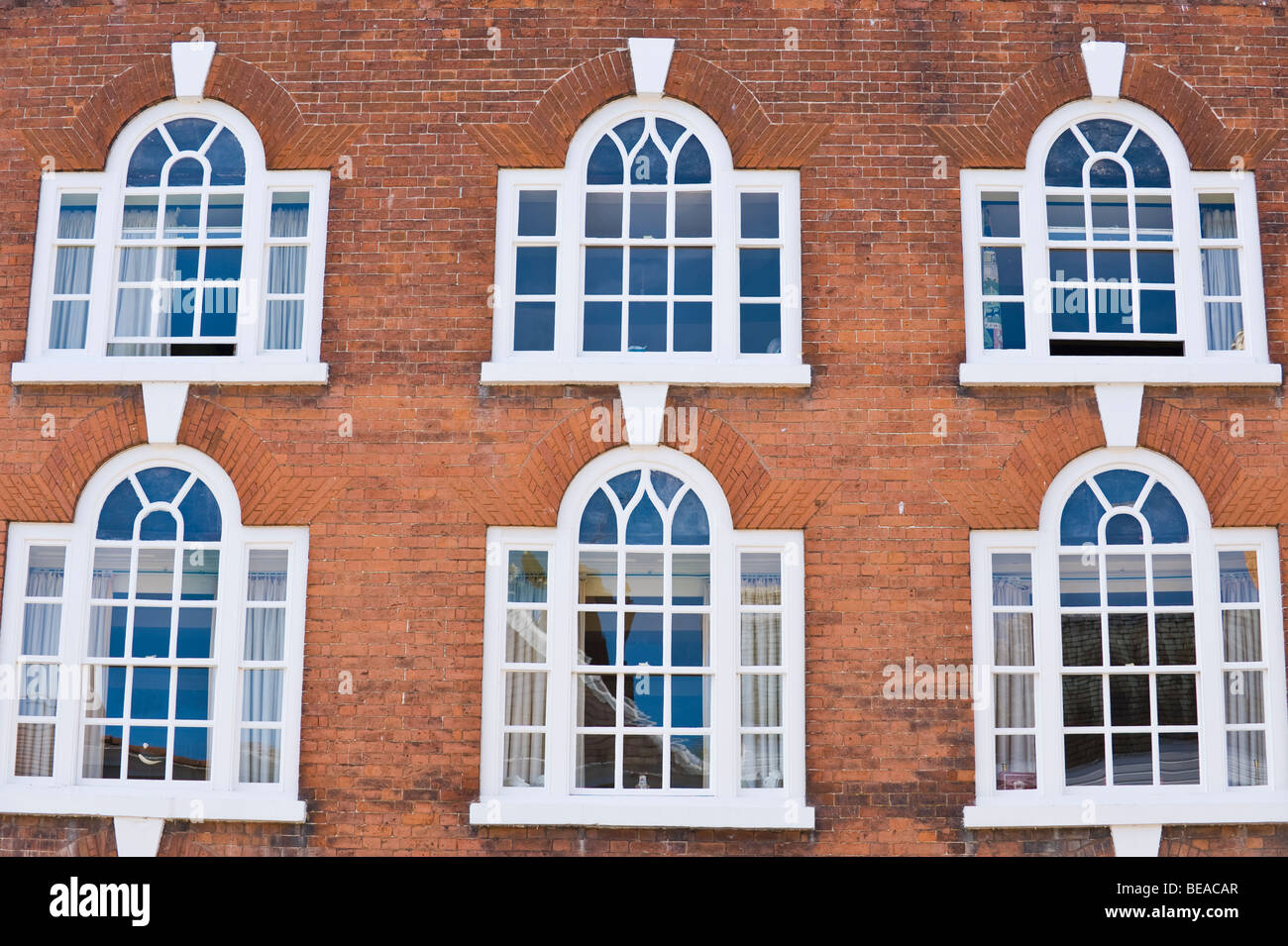 Palladian style sash windows in Georgian building with red brick facade ...