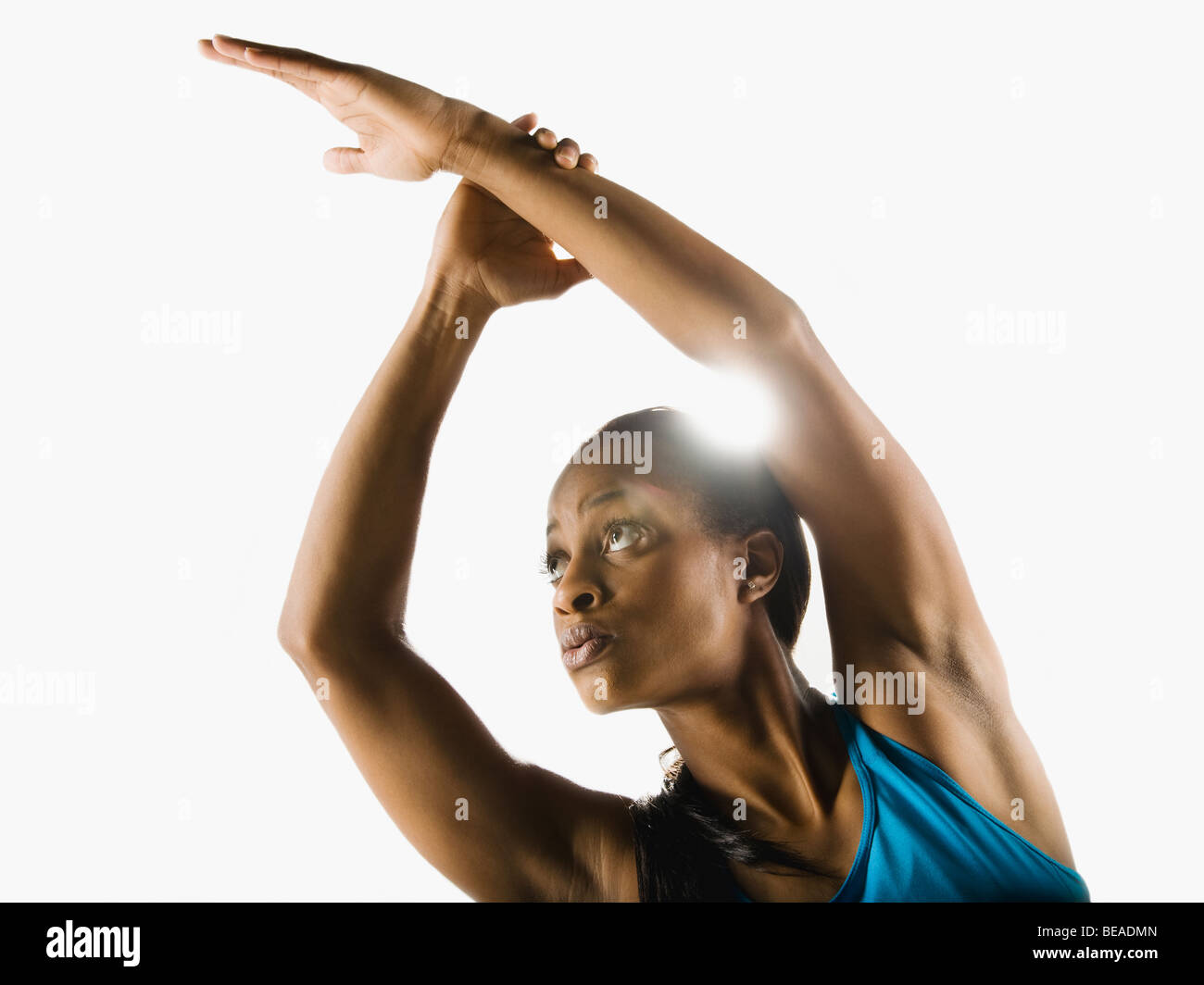Mixed race woman stretching arms overhead Stock Photo - Alamy