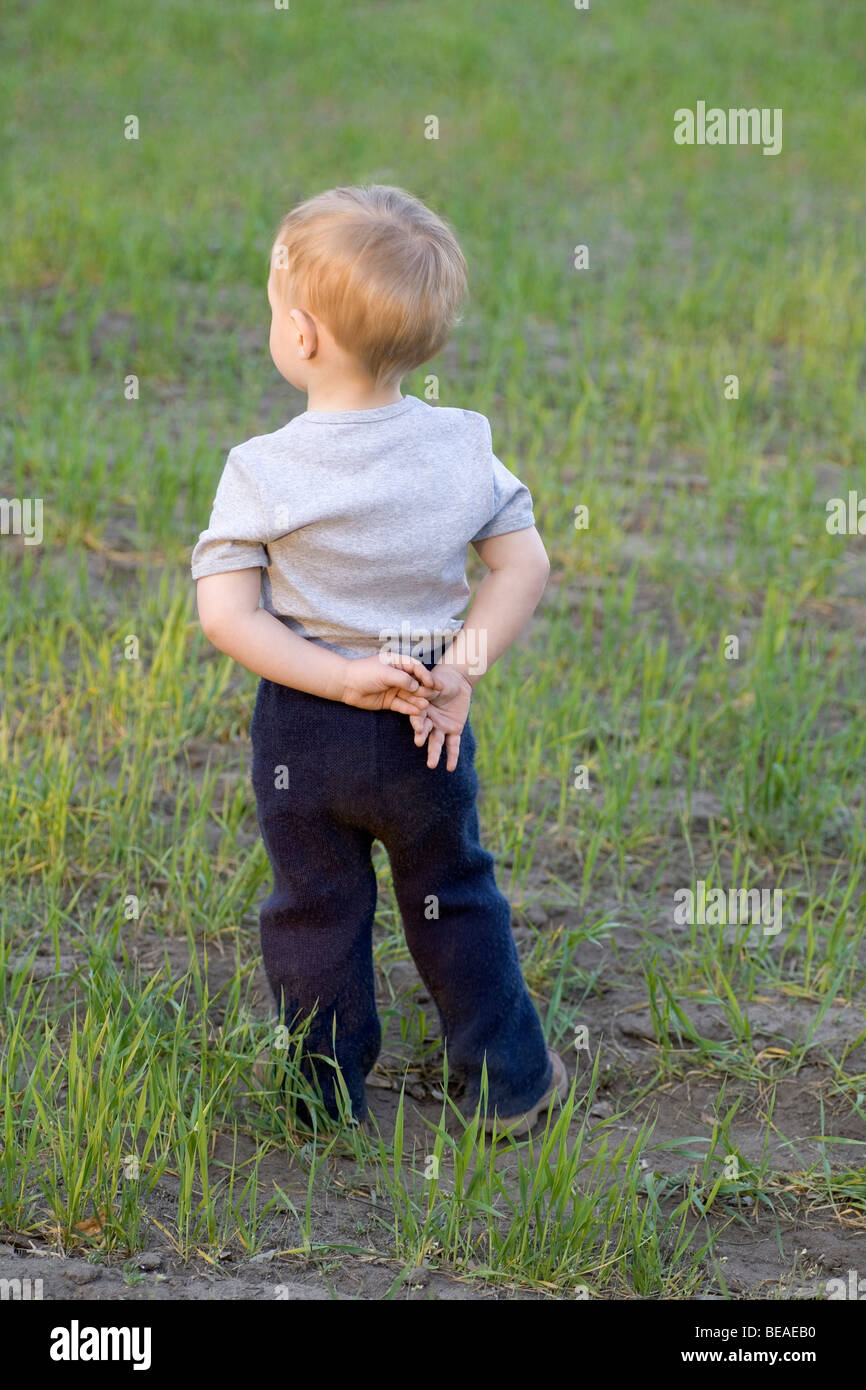 Portrait of a young boy, rear view, outdoors Stock Photo - Alamy