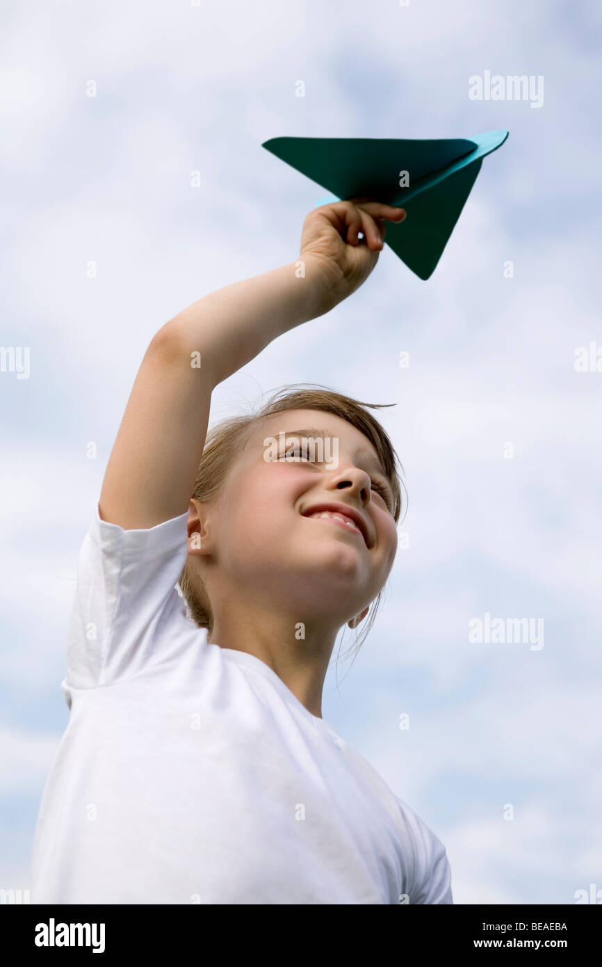A young girl holding a model airplane Stock Photo - Alamy