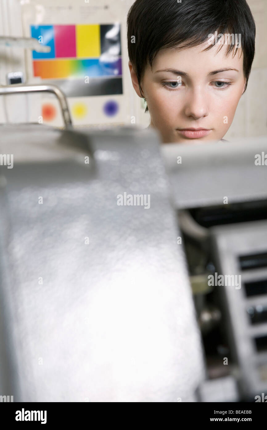 A woman working at a printers Stock Photo - Alamy