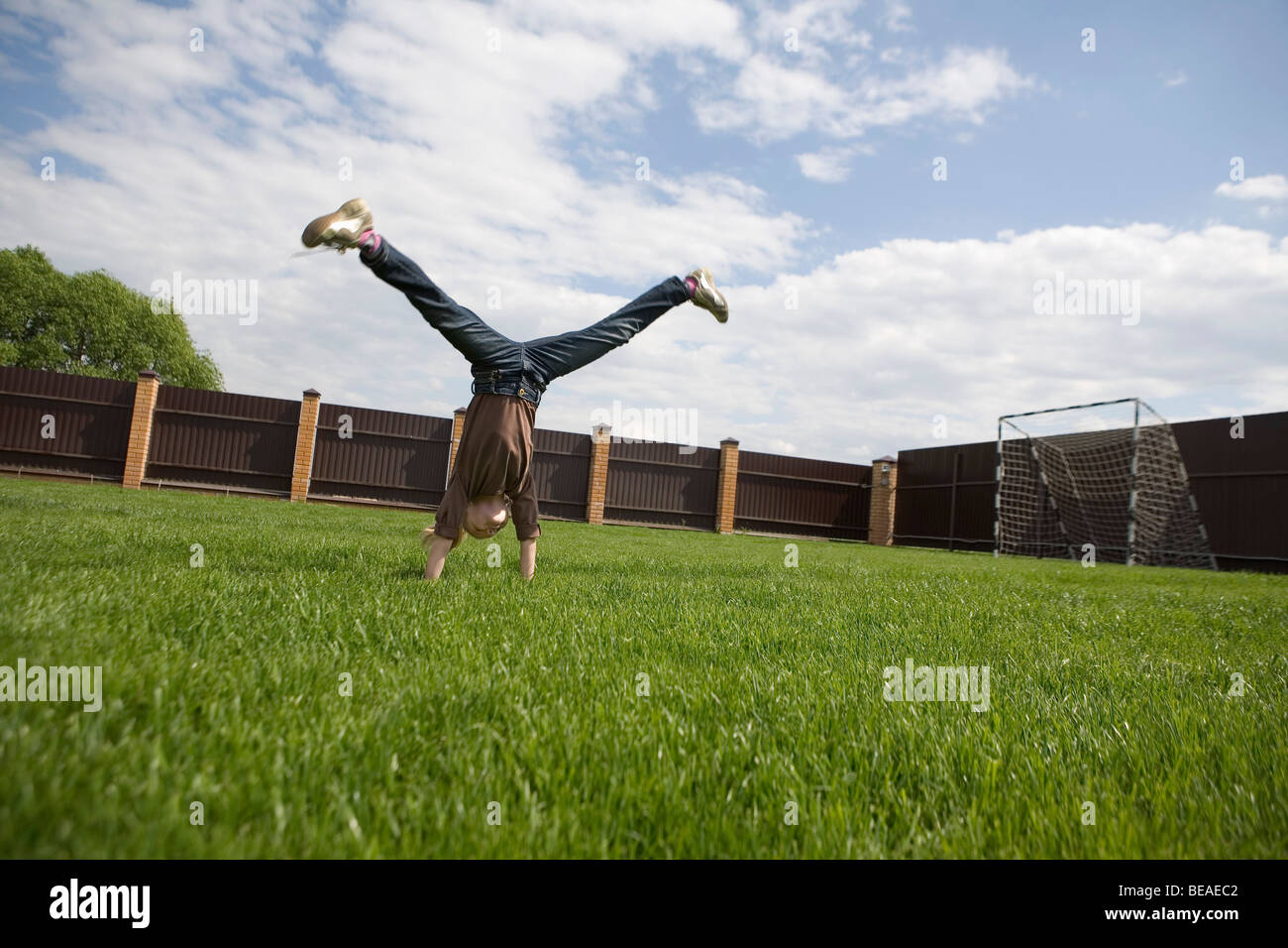 Girl doing a cartwheel hi-res stock photography and images - Alamy