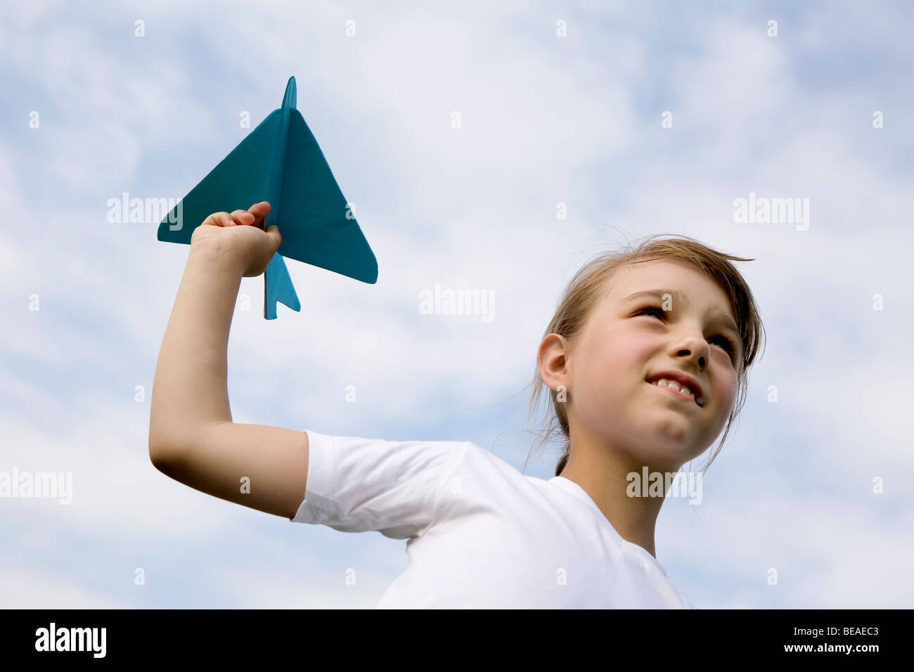 A young girl holding a model airplane Stock Photo - Alamy