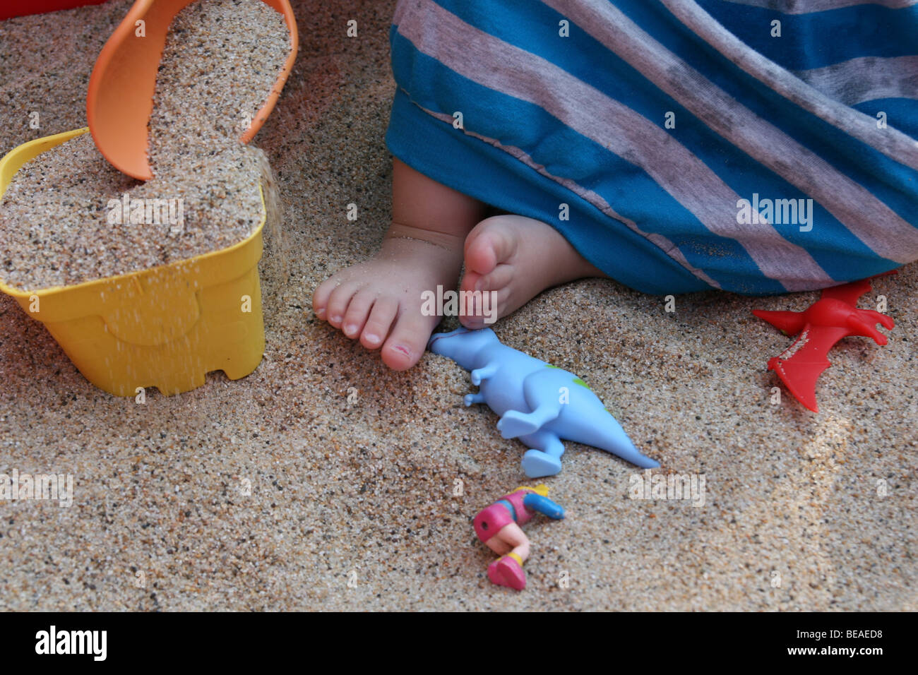 A toddler playing in a sand box Stock Photo - Alamy