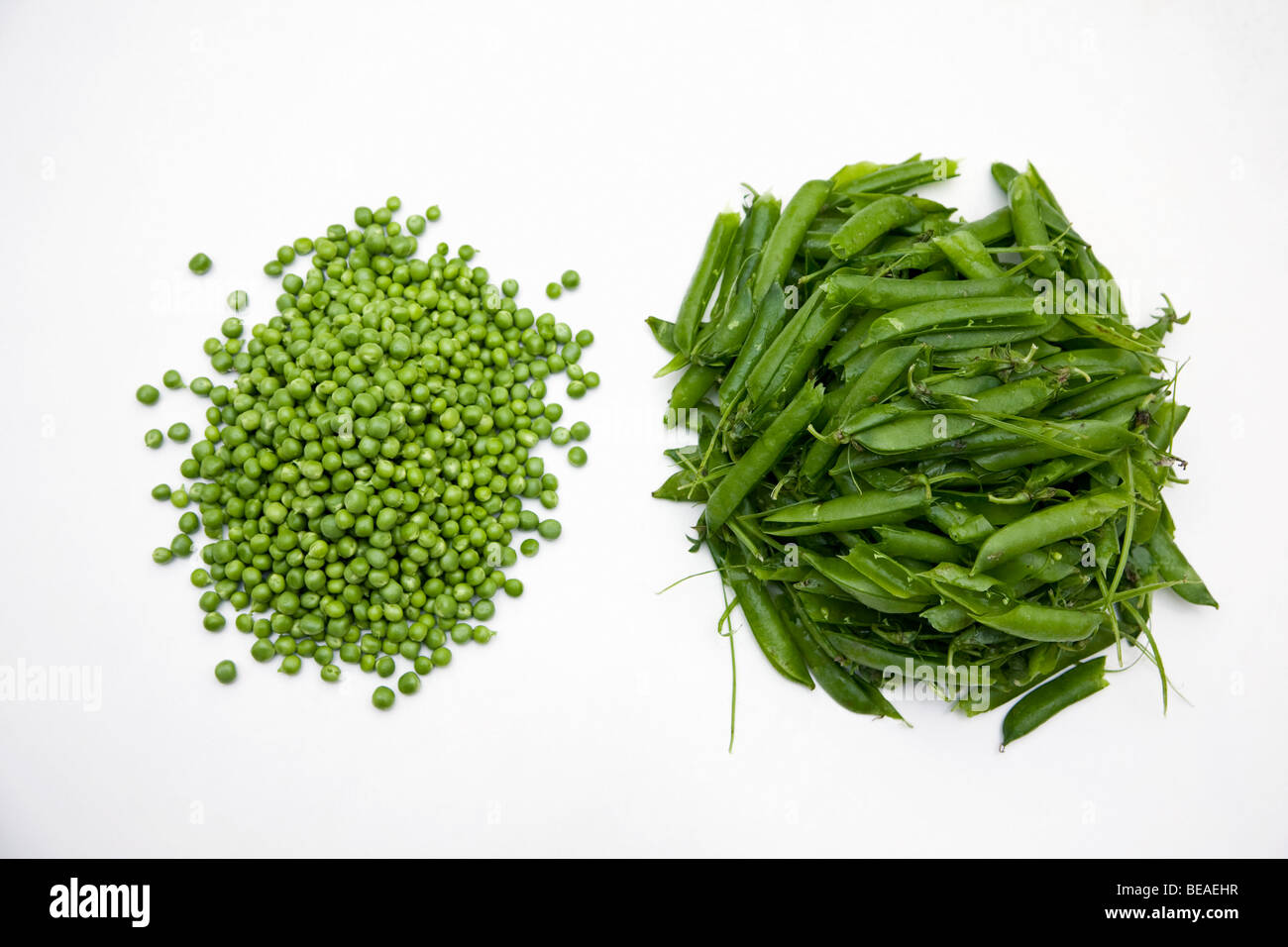 A pile of shelled peas and a pile of empty pods Stock Photo - Alamy