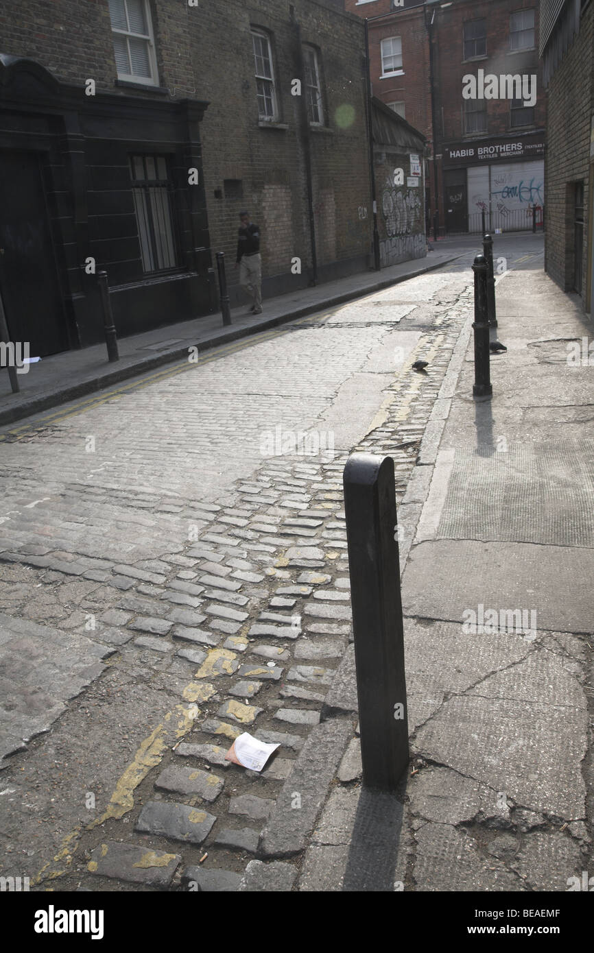 Back streets of London, cobbled road, Heneage Street, Whitechapel ...