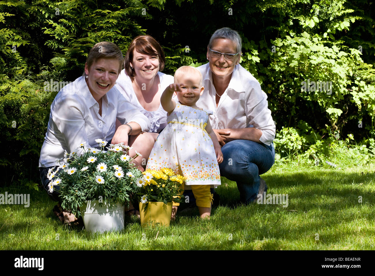 Formal portrait of three generations Stock Photo - Alamy