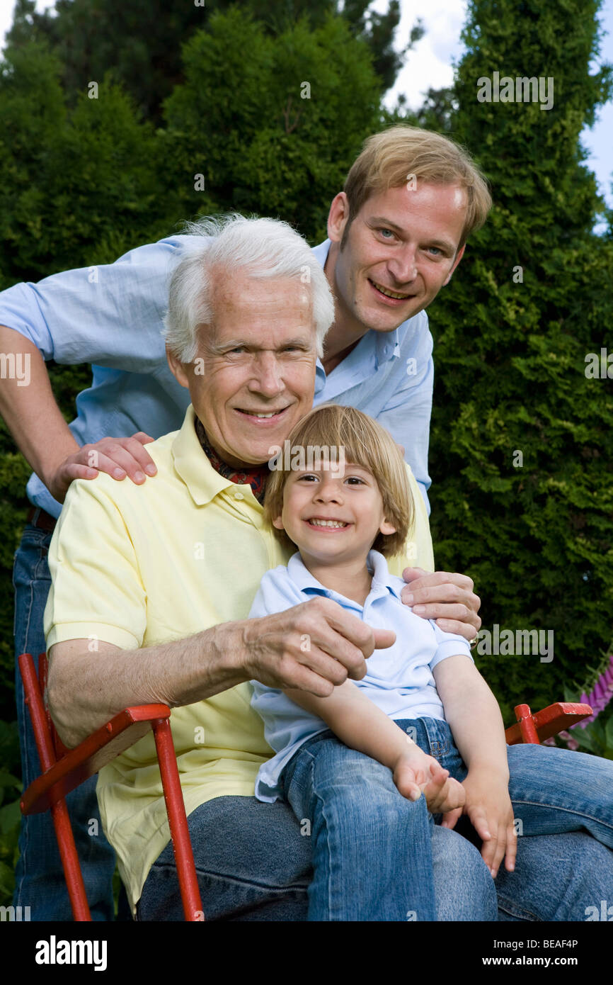 Portrait of a man with his son and grandson Stock Photo - Alamy