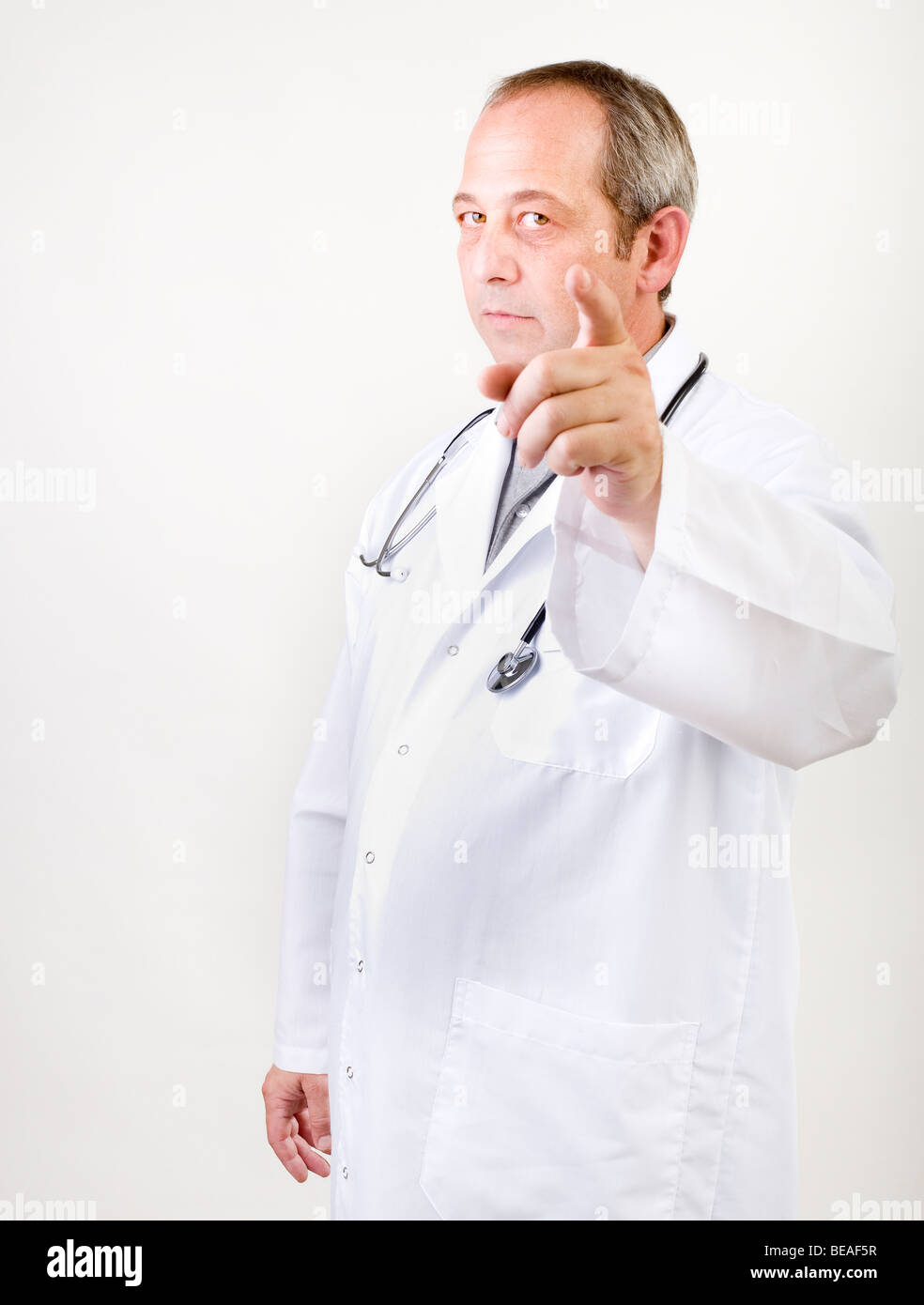 doctor pointing at camera isolated on white Stock Photo - Alamy