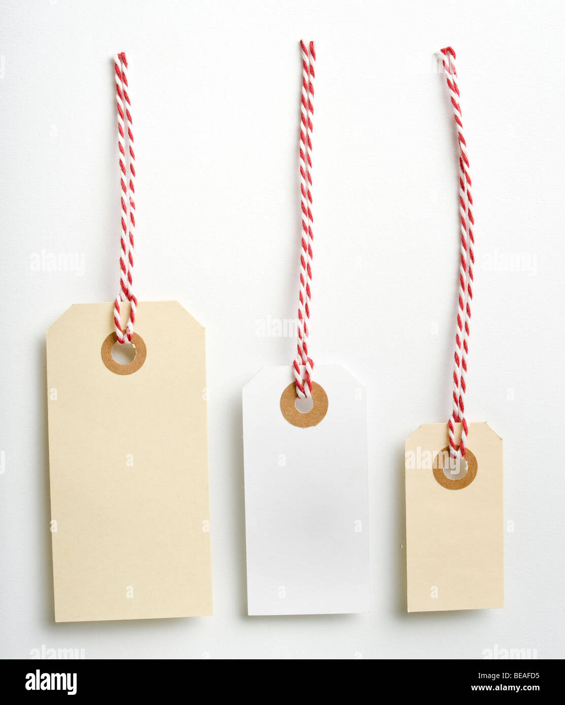 Three labels with a red and white rope isolated on white Stock Photo ...