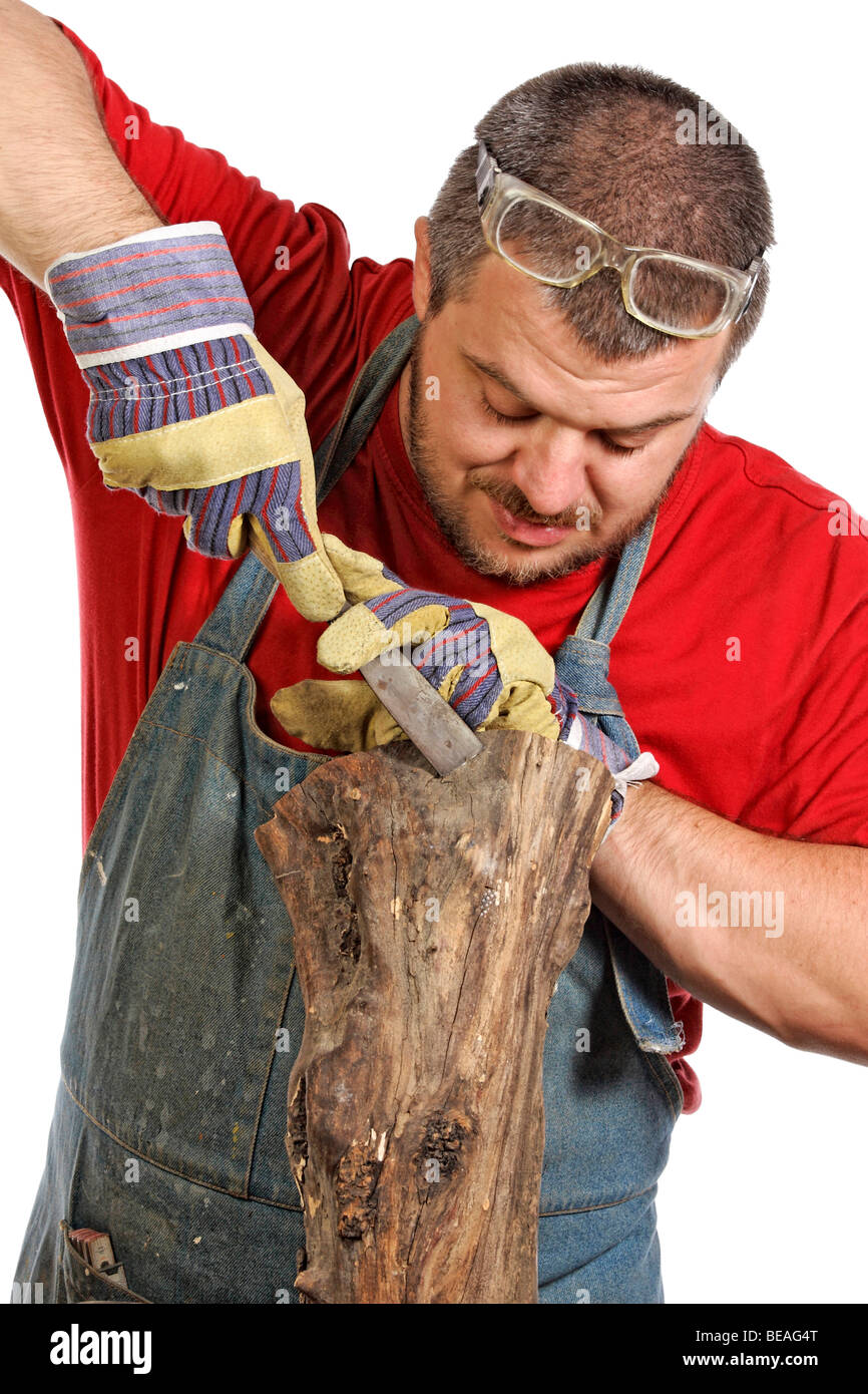 portrait of young man making sculpture from wood Stock Photo - Alamy