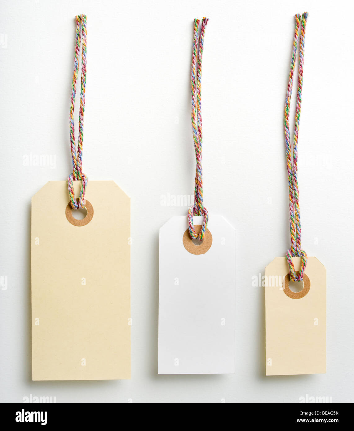 Three labels with colorful string isolated on white with photographic ...
