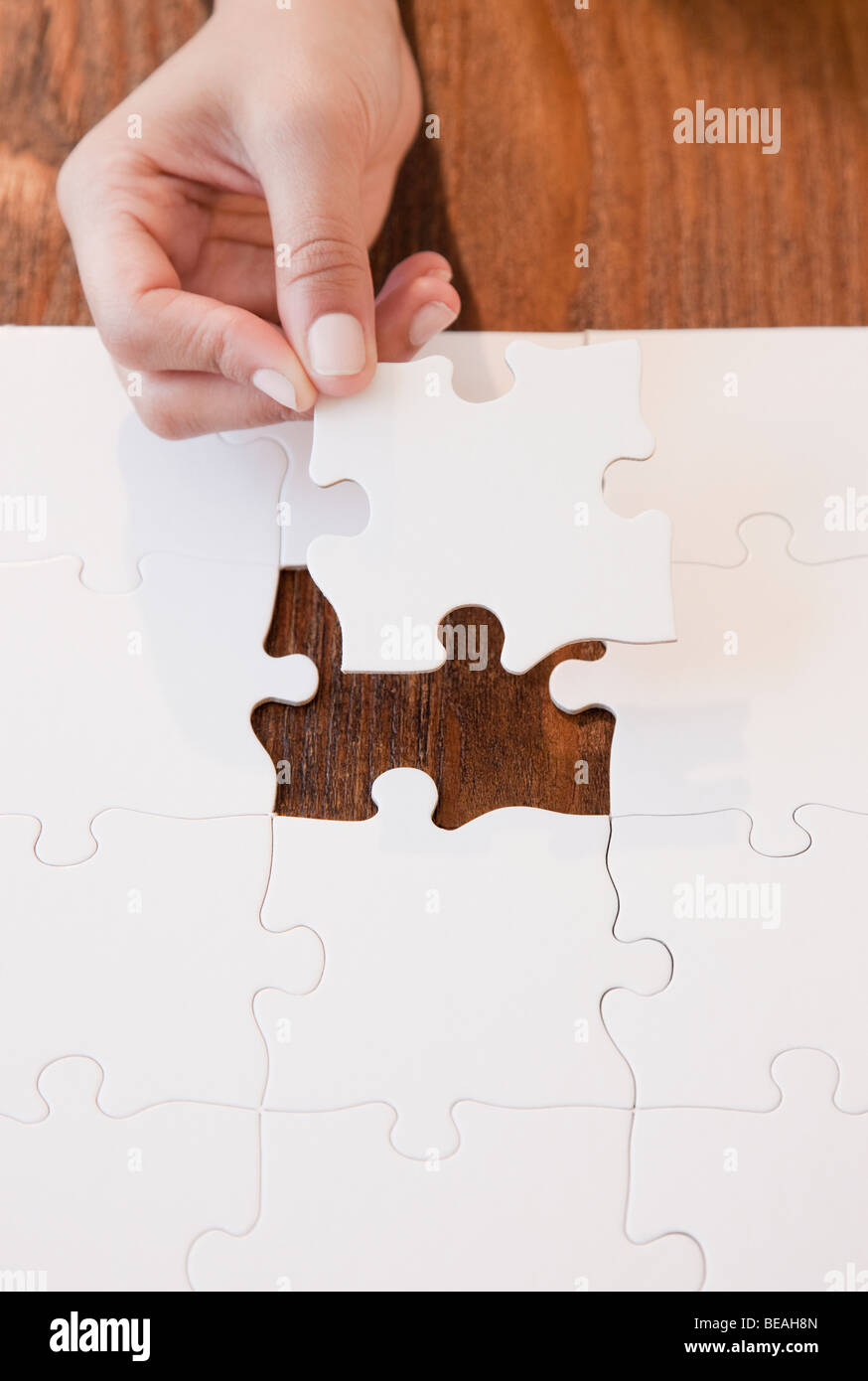 Completing jigsaw puzzle hi-res stock photography and images - Alamy