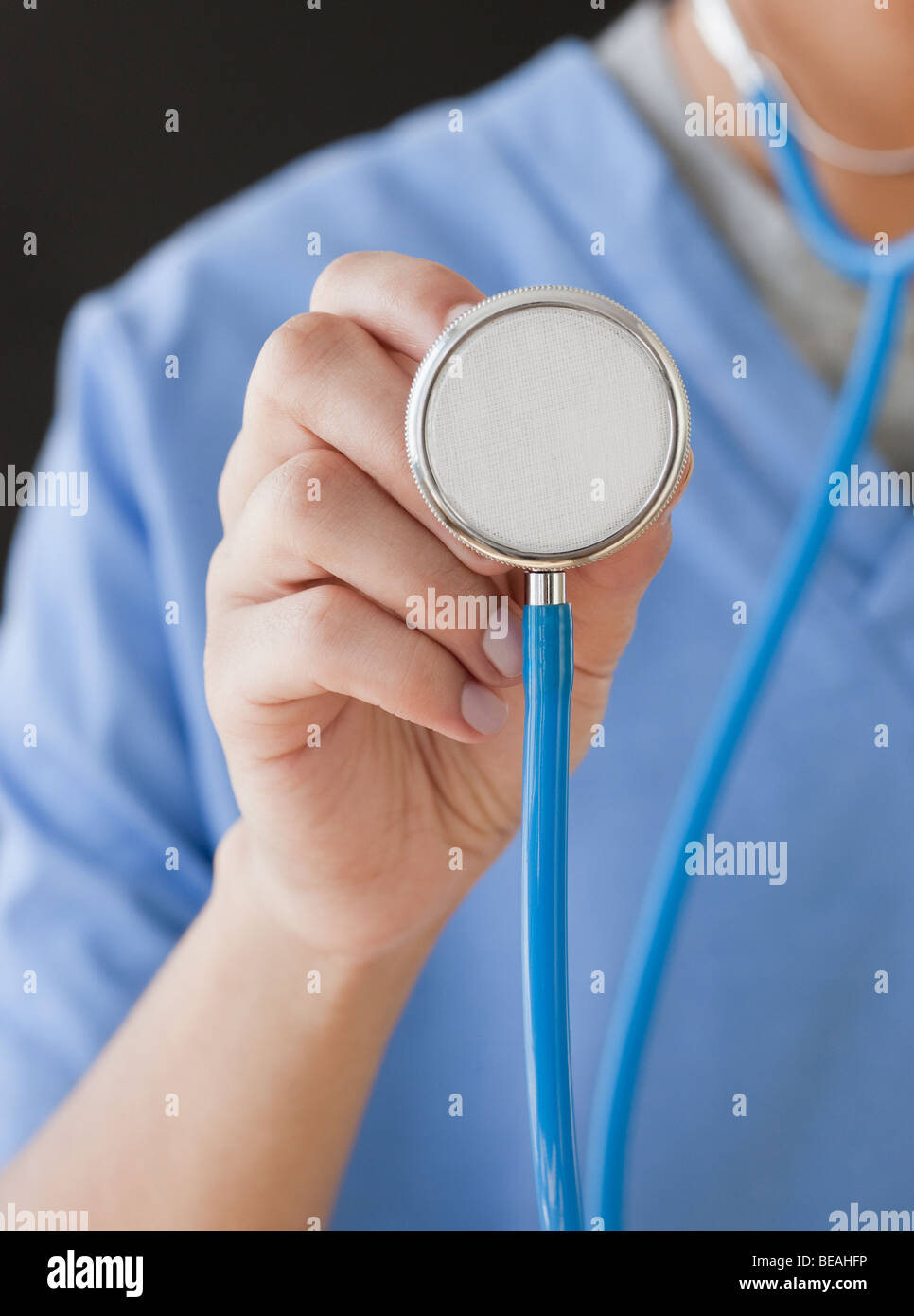 Doctor holding stethoscope Stock Photo - Alamy