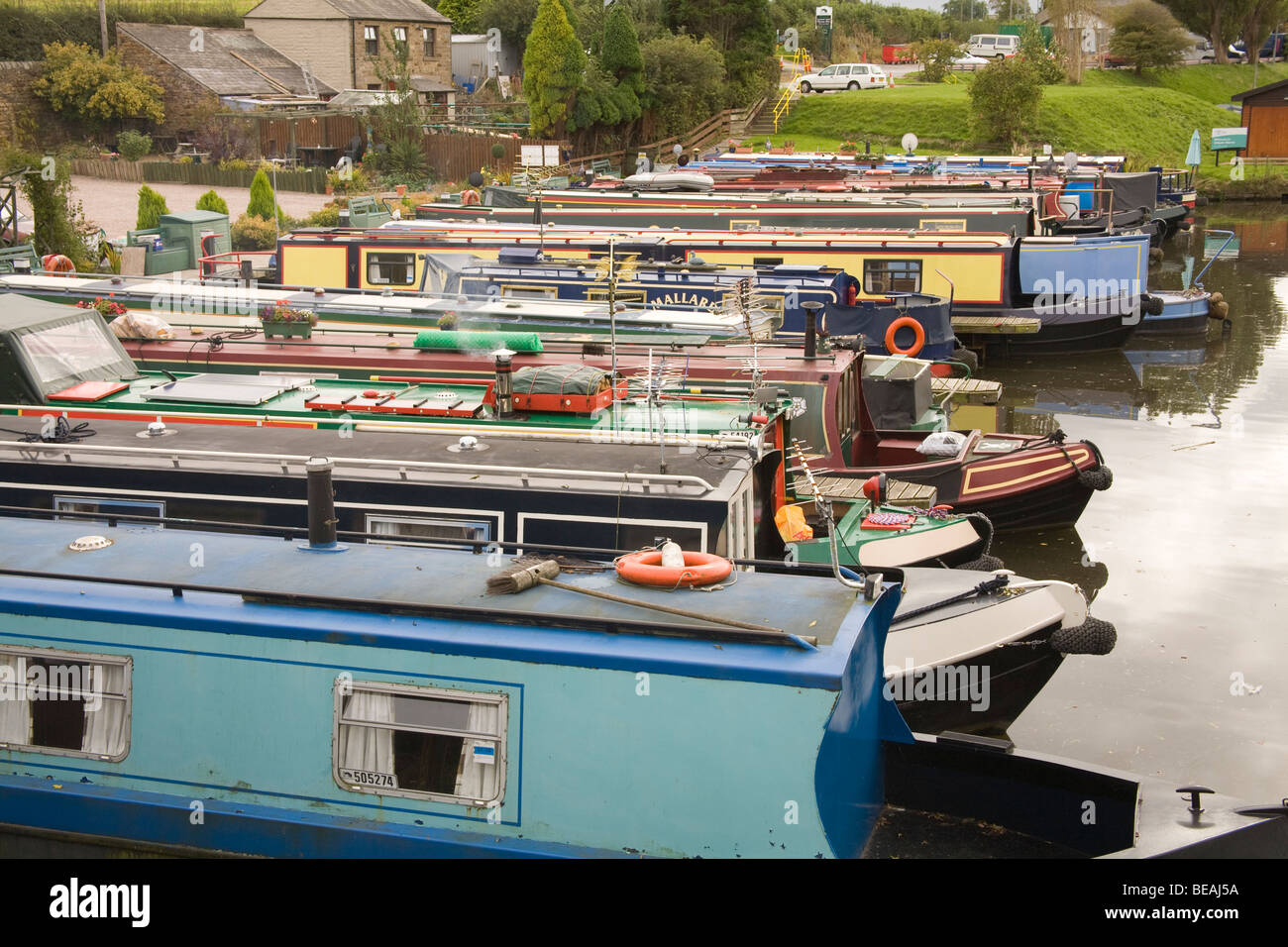 Galgate Lancashire England UK Row of narrowboats moored in the Galgate ...