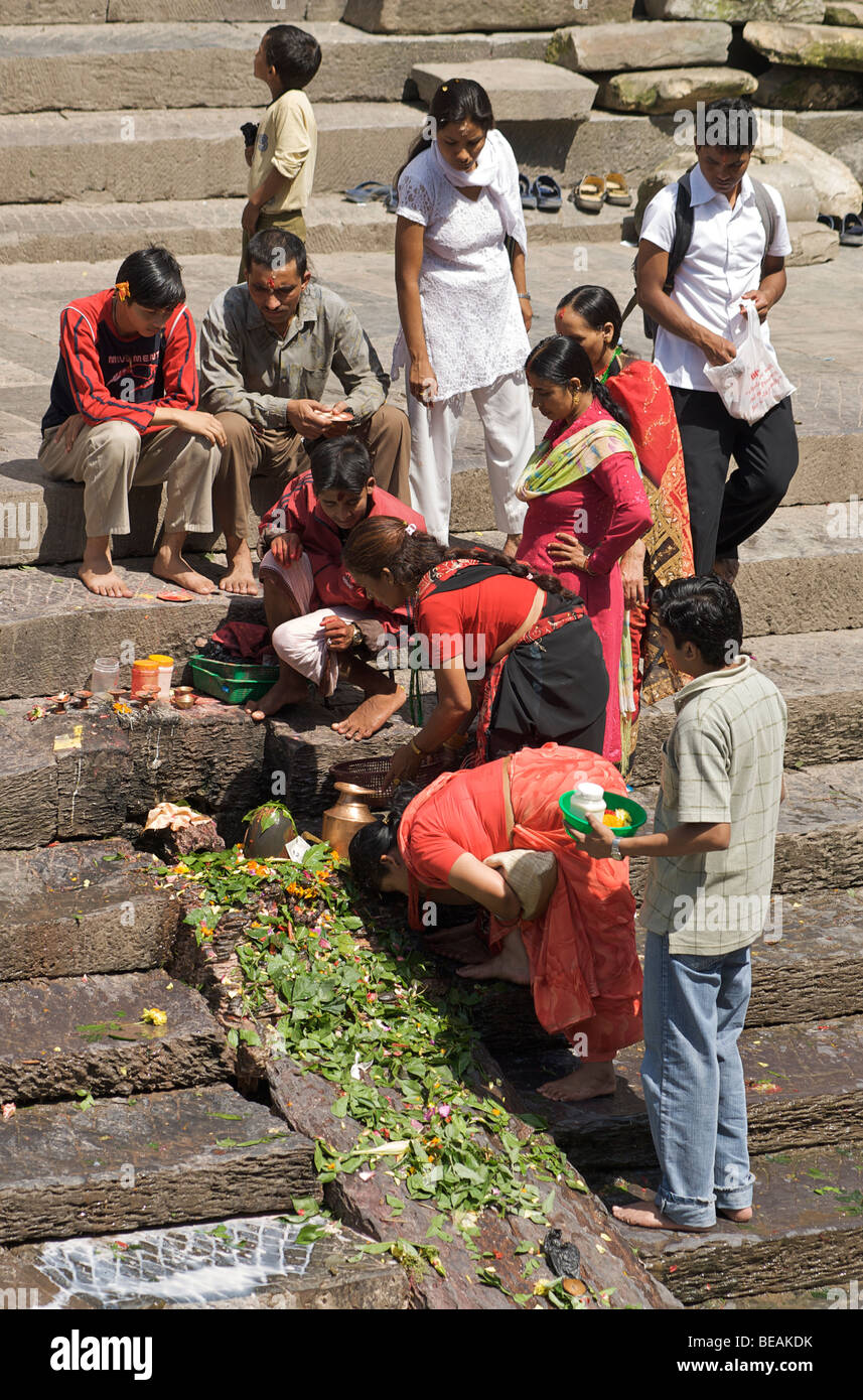 Nepalese Hindus performing rituals in the the Bagmati river at ...