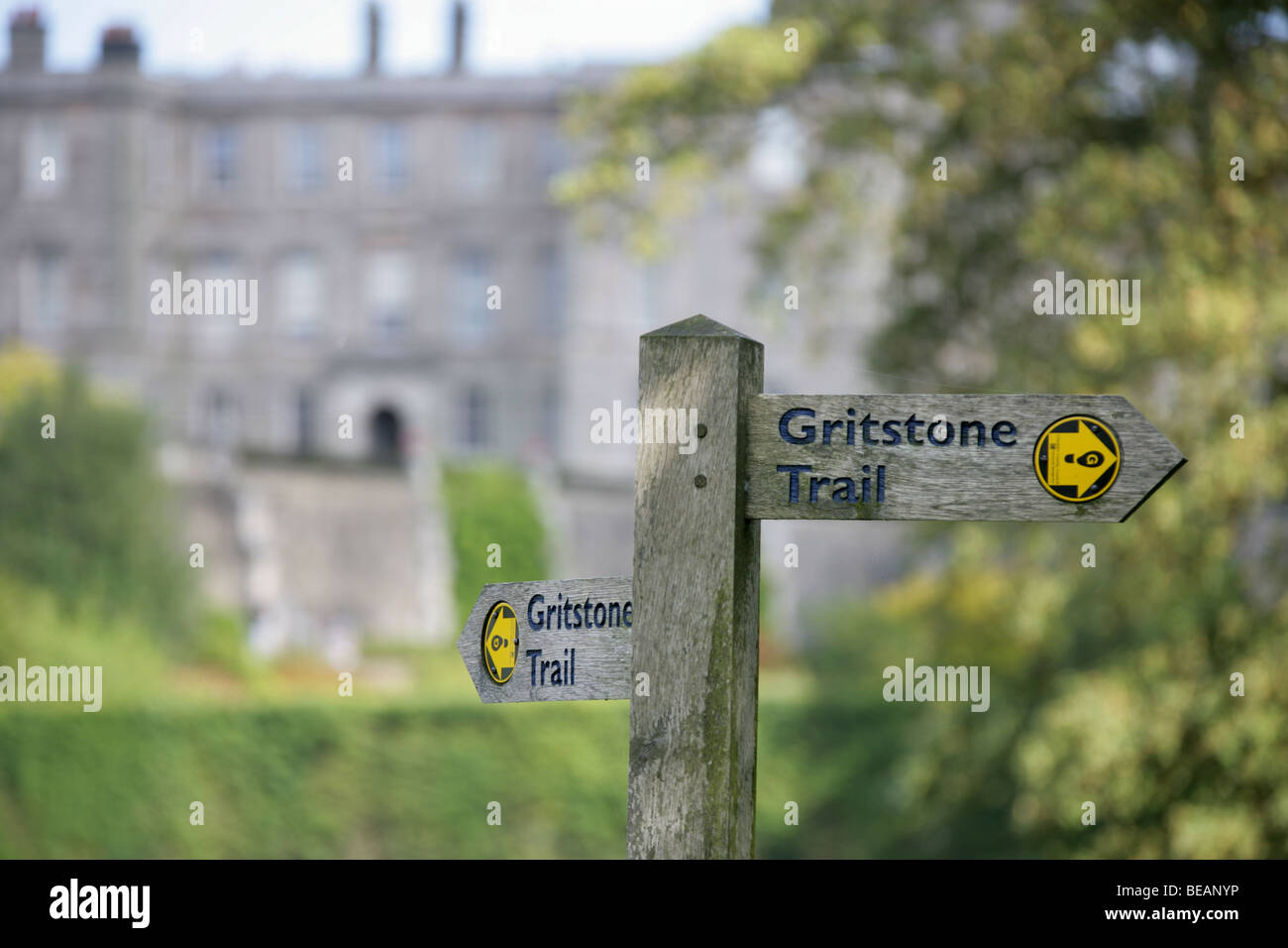 A Gritstone Trail direction sign with the National Trust managed Lyme ...