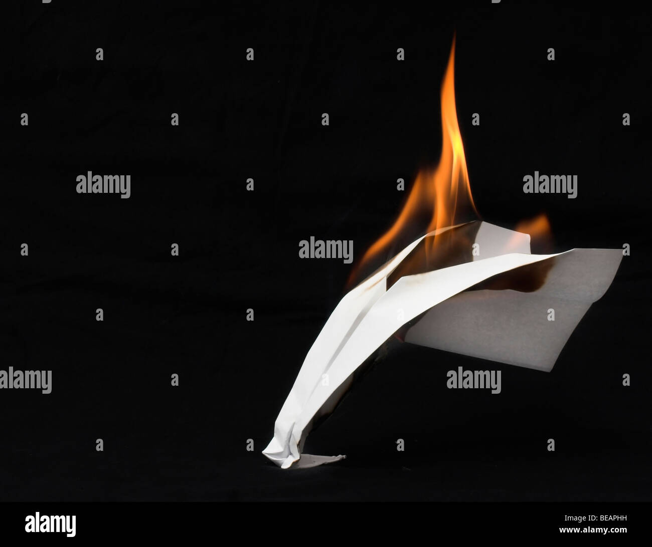 Paper airplane in flames Stock Photo - Alamy