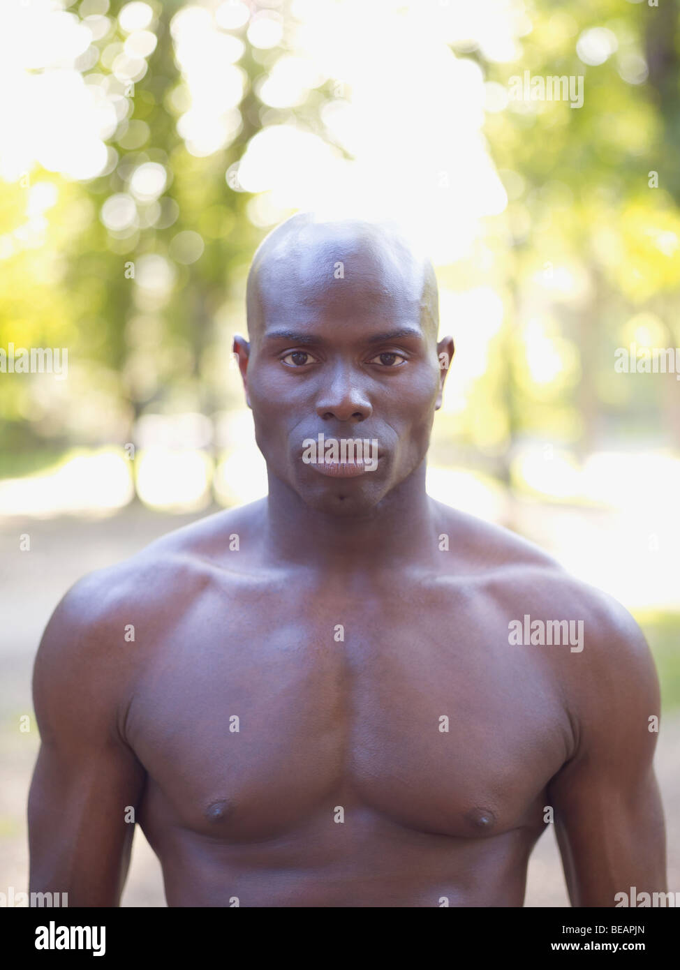 Serious African man with bare chest Stock Photo - Alamy