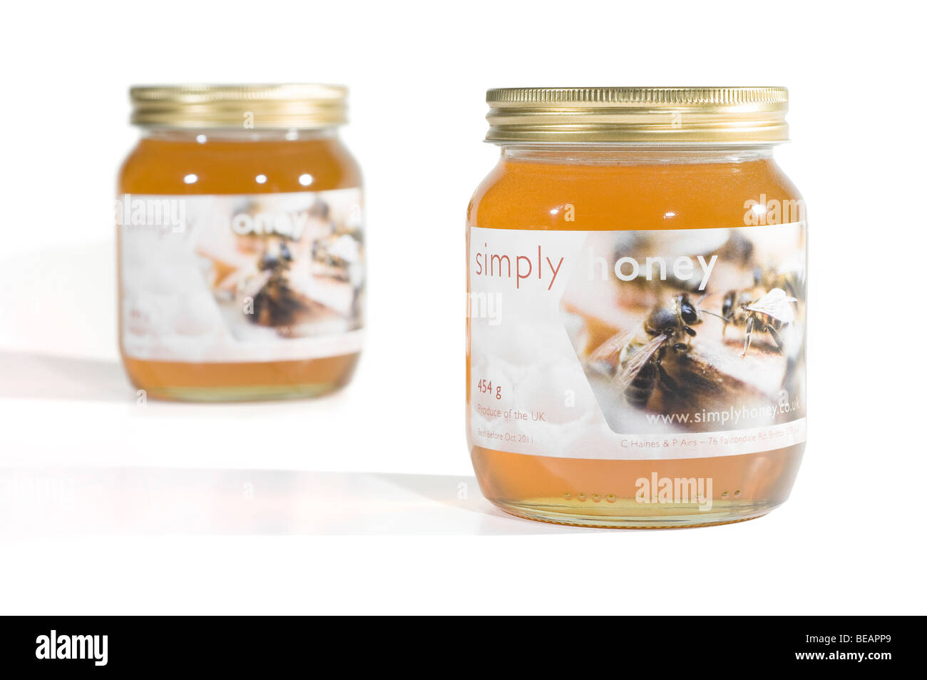 Simply Honey labelled full jars of honey Stock Photo - Alamy