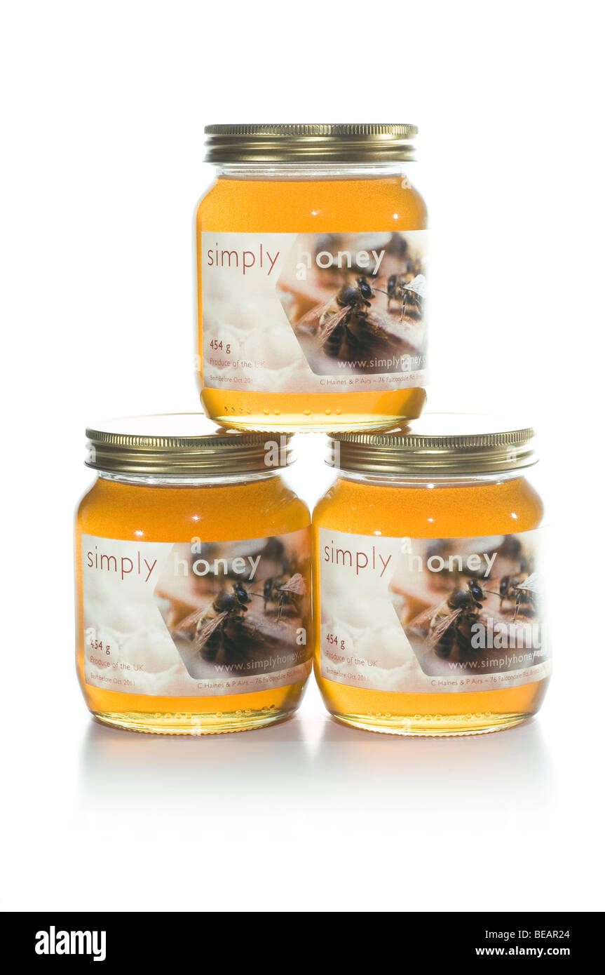 Simply Honey labelled full jars of honey Stock Photo - Alamy