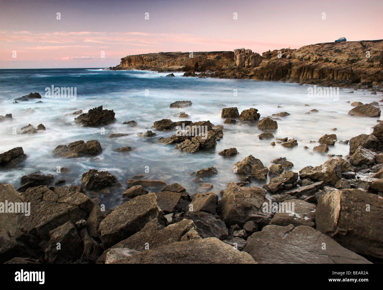 Picture of the sunset with beautiful rocks on the ocean Stock Photo - Alamy