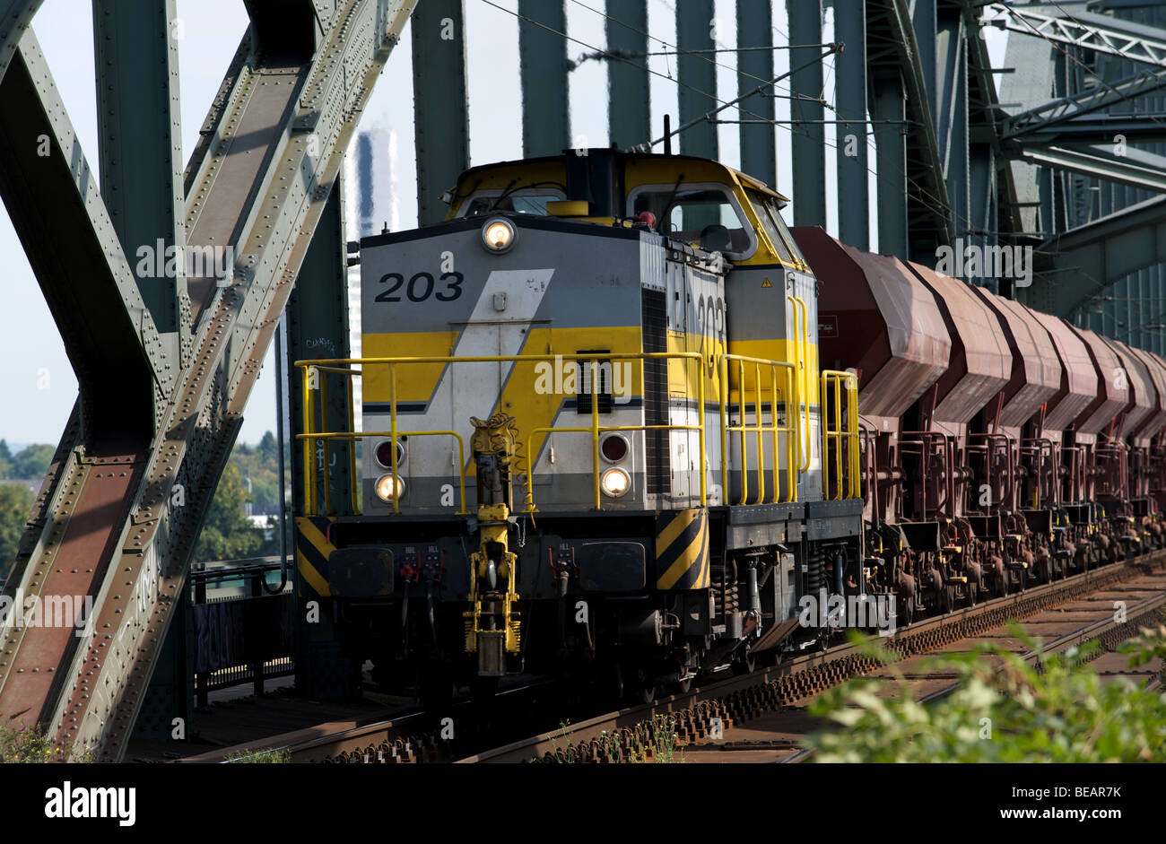 Freight train hauling aggregates, crossing the south railway bridge ...