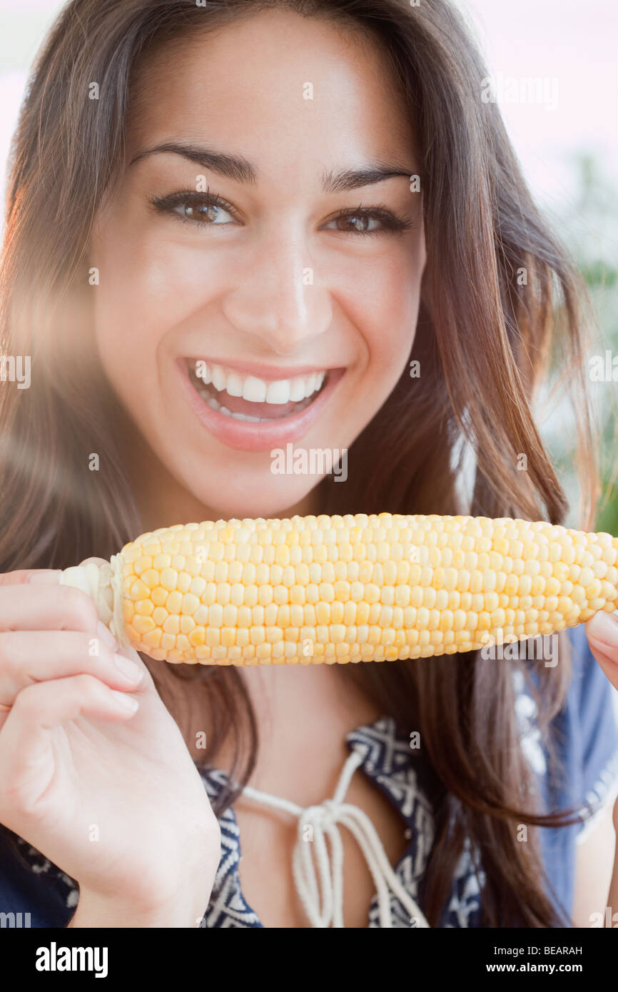 Hispanic woman eating corn on cob hi-res stock photography and images ...