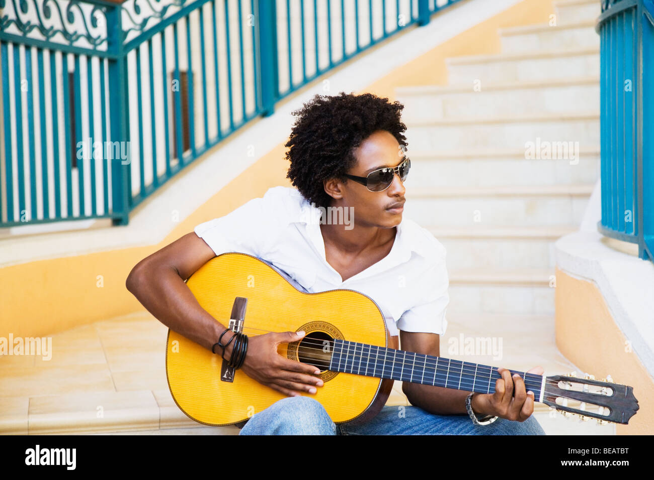 African man playing guitar Stock Photo - Alamy