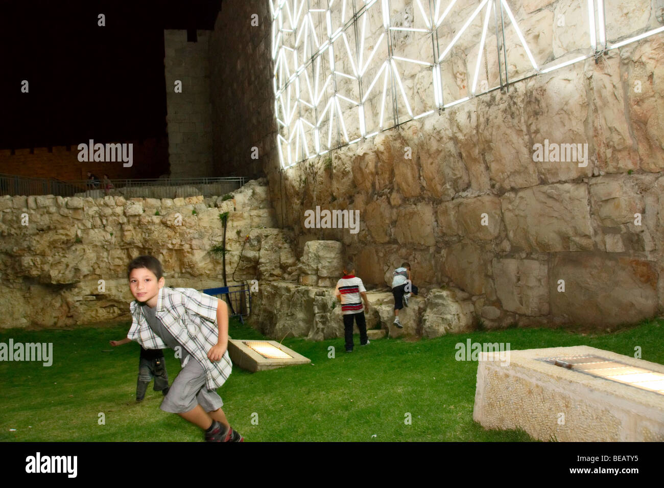 Israel. Kids playing near the "Arabesque" light sculpture at Jerusalem ...