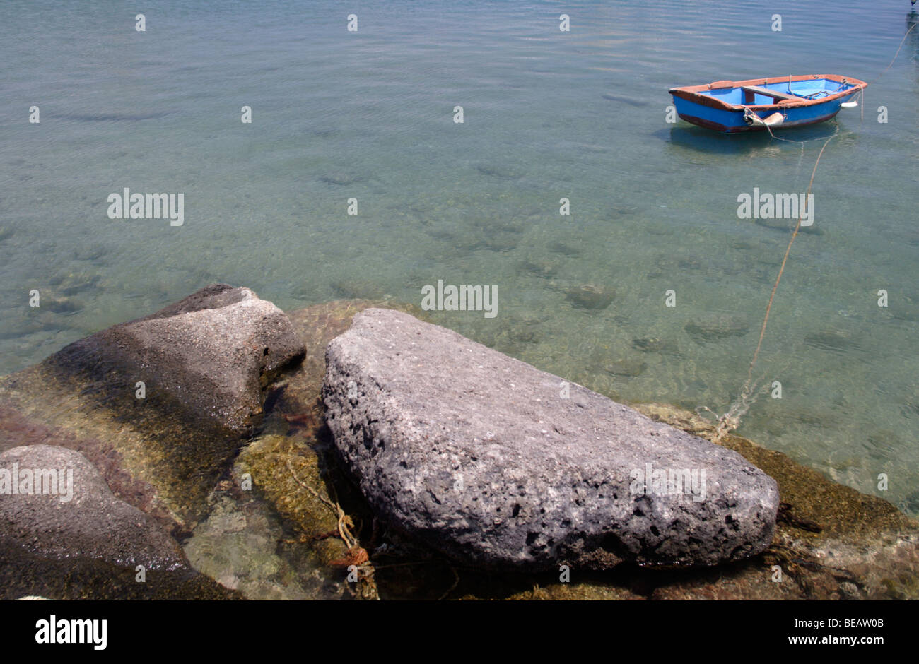 Rowing boat floatibg on water, Rhodes, Greece Stock Photo - Alamy