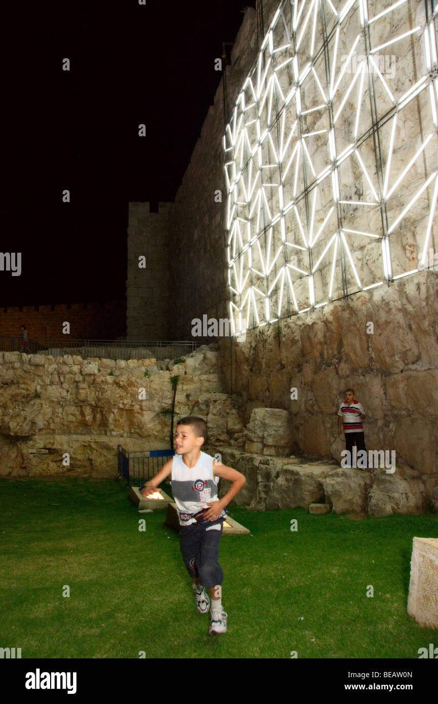Israel. Kids playing near the "Arabesque" light sculpture at Jerusalem ...