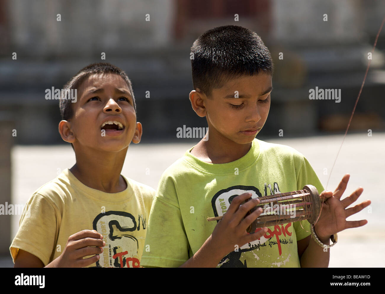 Nepalese boys kite flying with kite reel in hand, Kathmandhu, Nepal ...