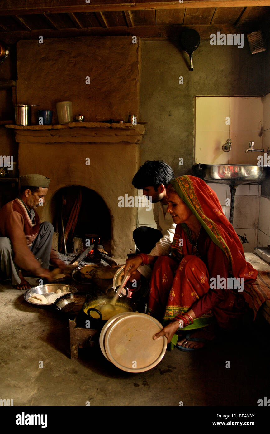 Villagers cook hi-res stock photography and images - Alamy