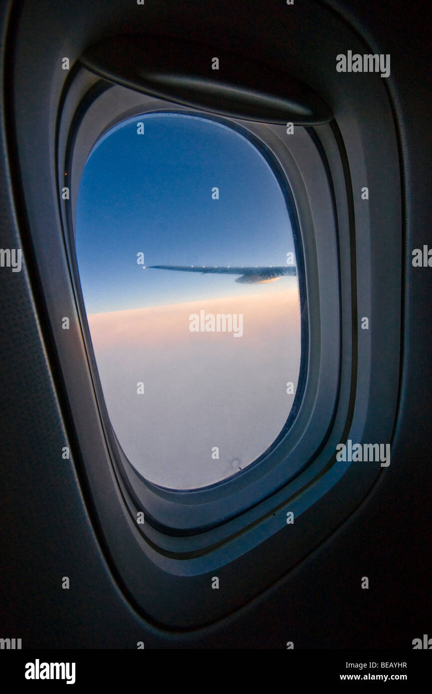 Sunrise as viewed from an airplane window Stock Photo - Alamy