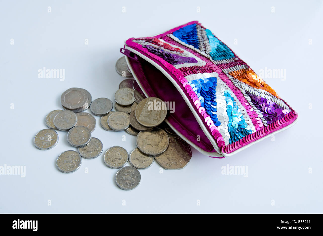 Sequin zip purse (UK flag) with silver coins. Likely to be used by a ...