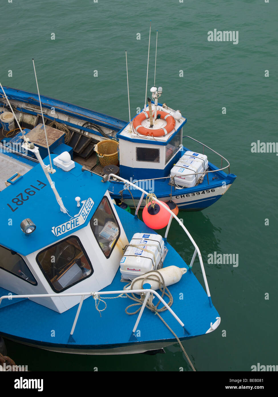 Two blue fishing boats hi-res stock photography and images - Alamy