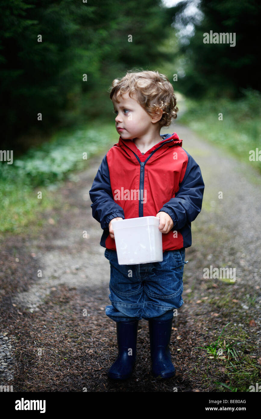 Young Boy With Plastic Box Stock Photo - Alamy