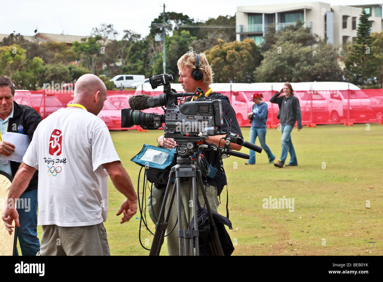TV Cameraman taking stock footage of a beach Stock Photo - Alamy