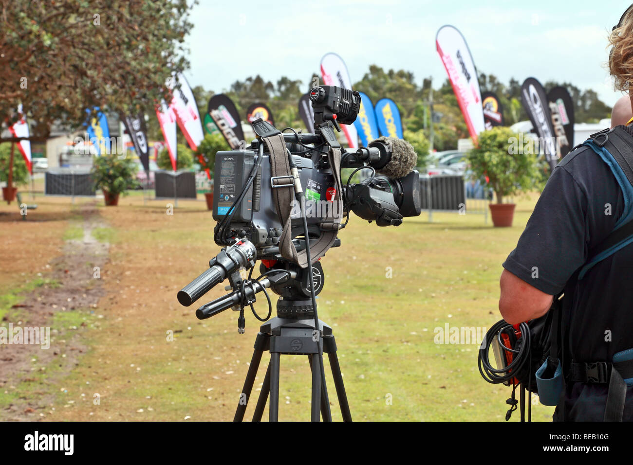 TV Cameraman taking stock footage of a beach Stock Photo - Alamy
