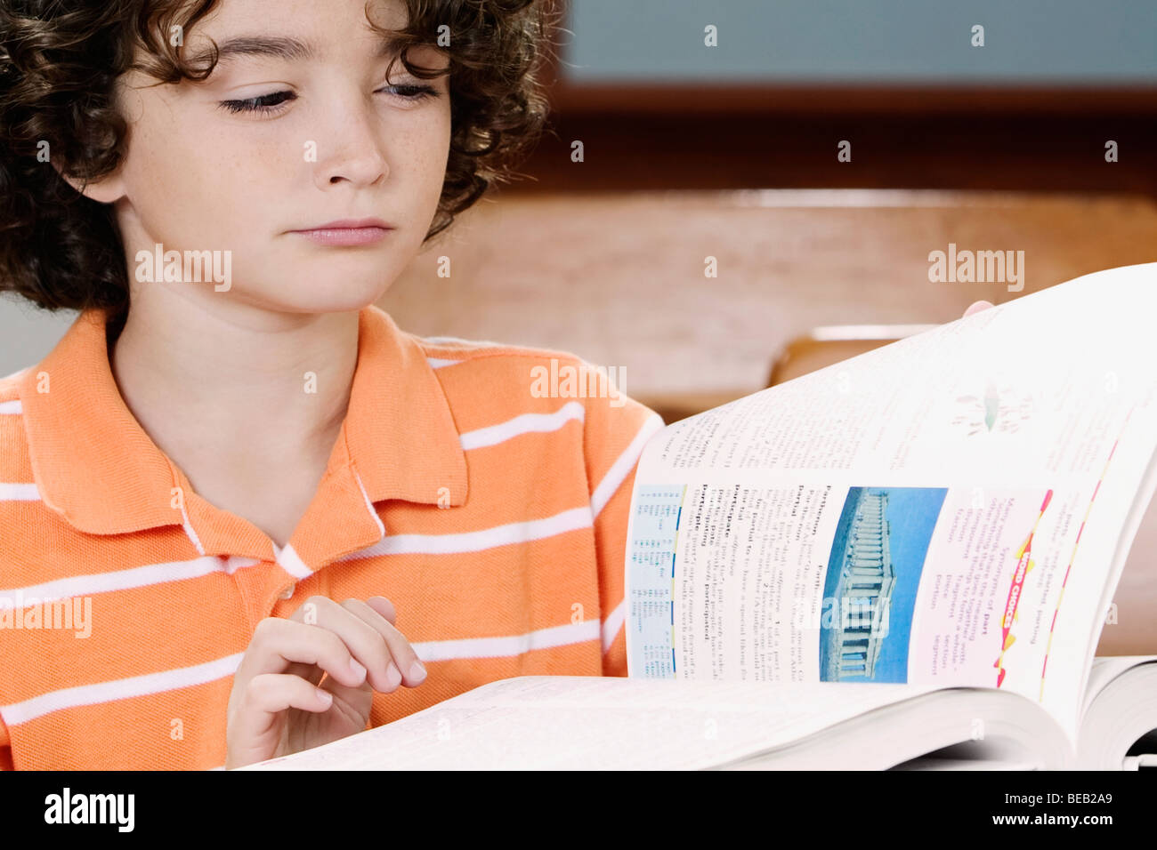 Schoolboy studying in a classroom Stock Photo - Alamy Schoolboy studying in a classroom Stock Photo - Alamy