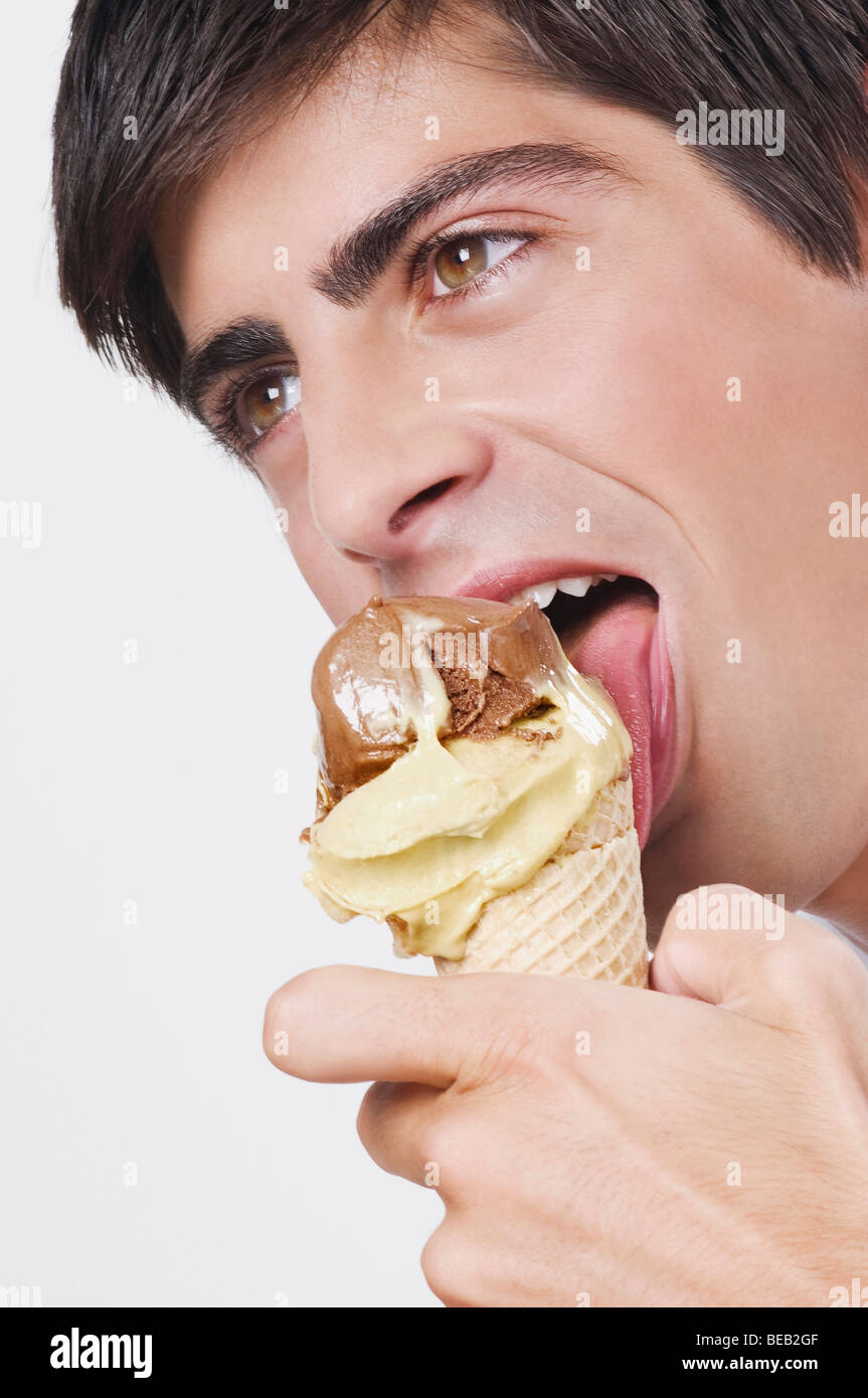 Close-up of a man eating an ice cream Stock Photo - Alamy