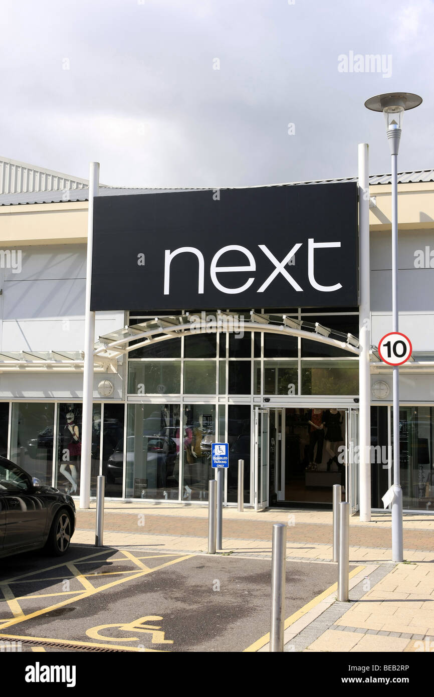 Next fashion wear Store and overhead sign Stock Photo - Alamy