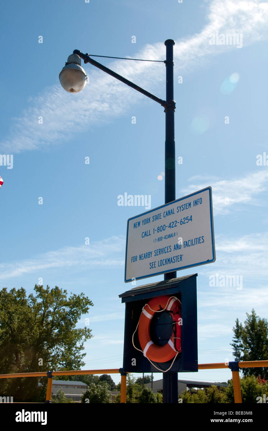 Sign and lifesaver at Erie Canal lock in Mays Point, NY USA Stock Photo ...