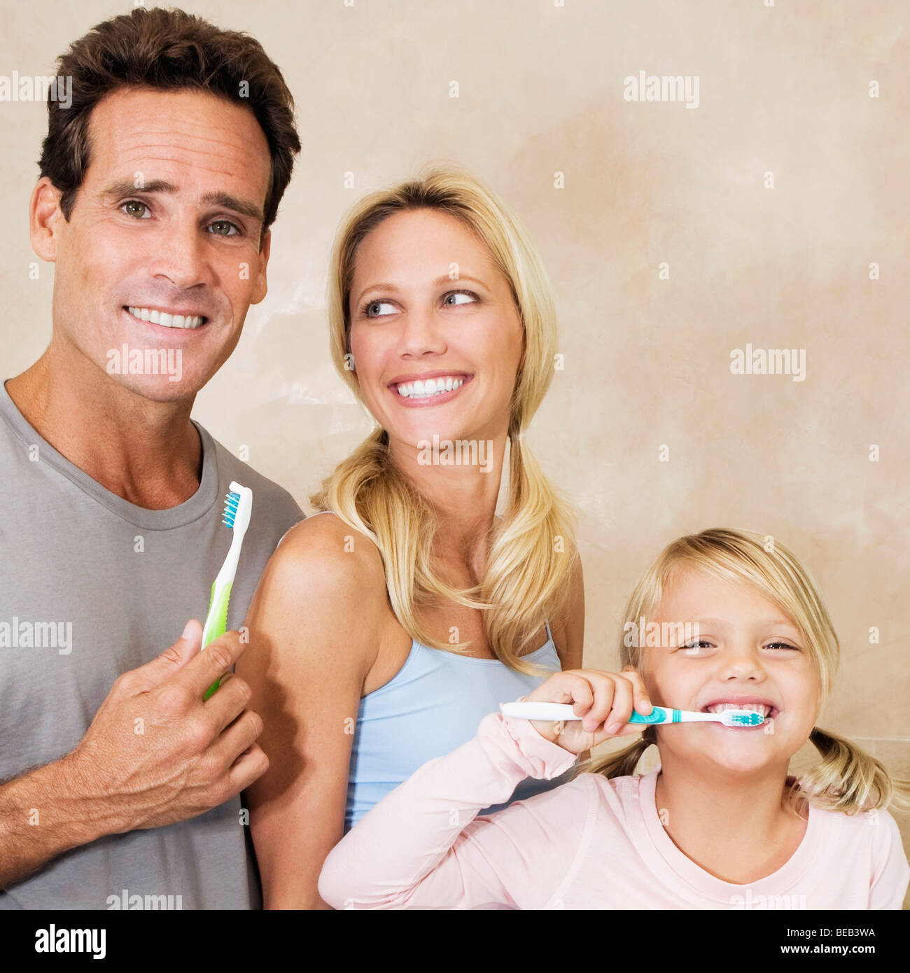 Family brushing teeth in the bathroom Stock Photo - Alamy