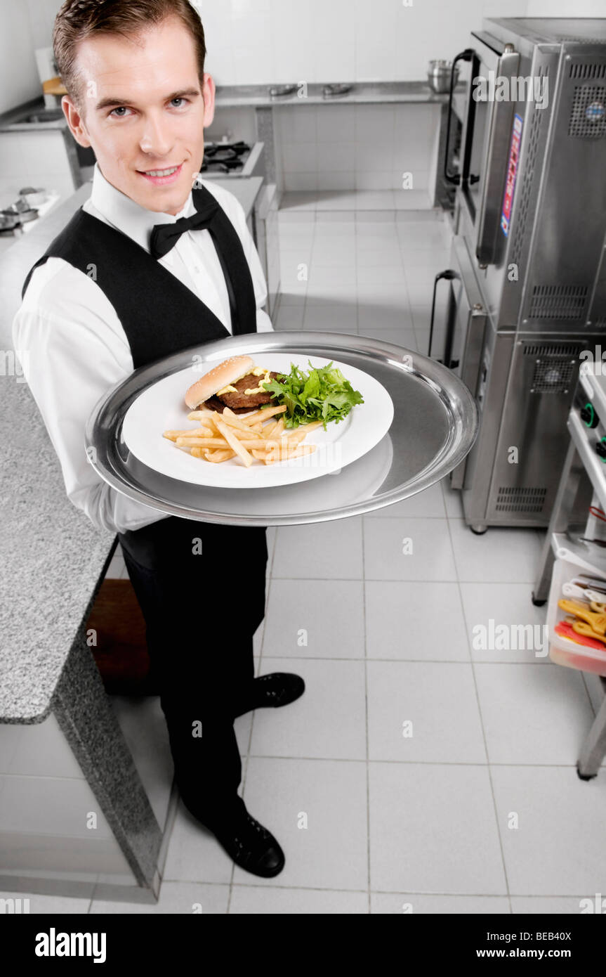 Waiter serving food full view hi-res stock photography and images - Alamy
