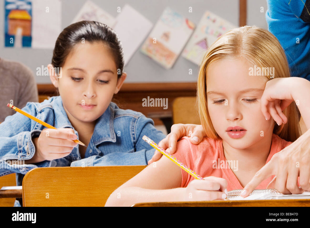 Schoolgirls studying in a classroom Stock Photo - Alamy